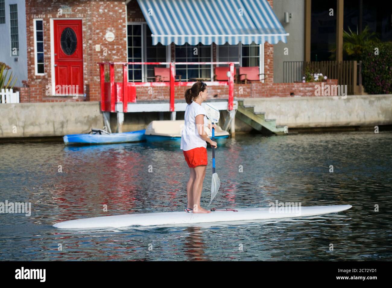 Paddle boarding on the Grand Canal on Balboa Island,Newport Beach ...