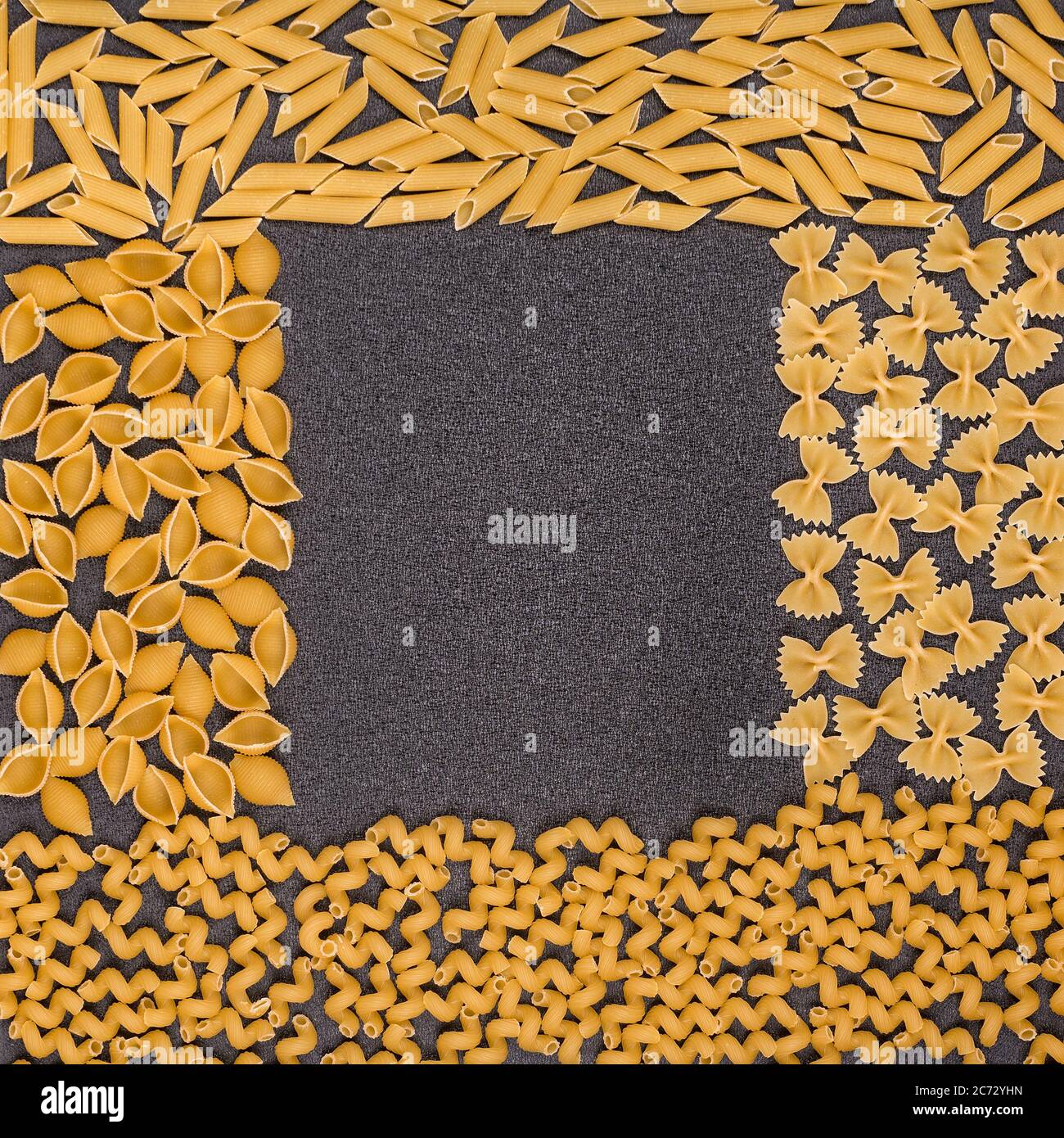 Different types cheese Italian pasta on grey background. Square frame ...