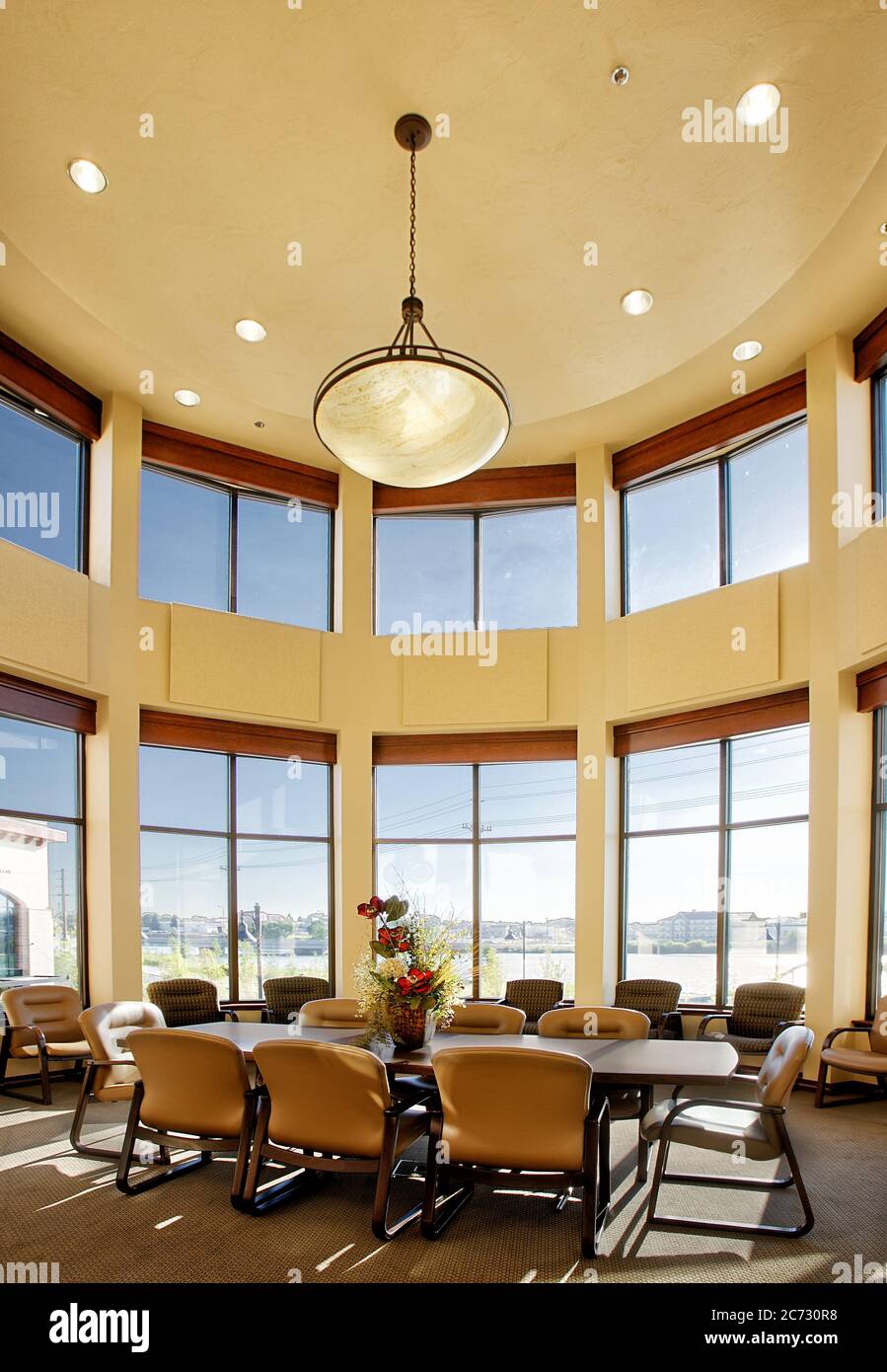 Sunlight streaming through the windows of a modern corporate conference ...