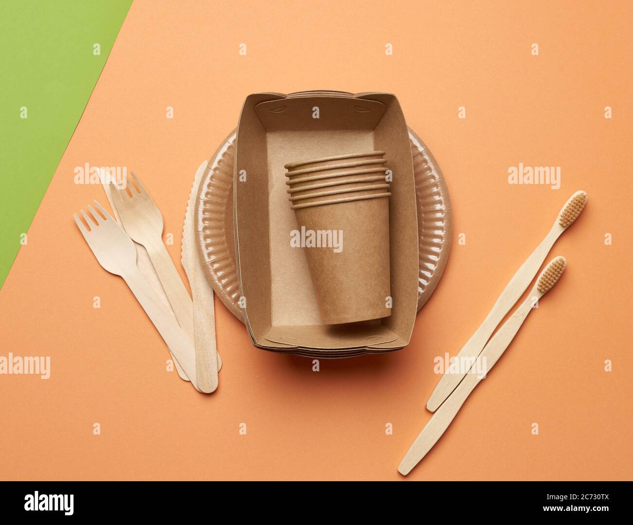 paper plates and cups from brown craft paper and wooden forks and knive ...