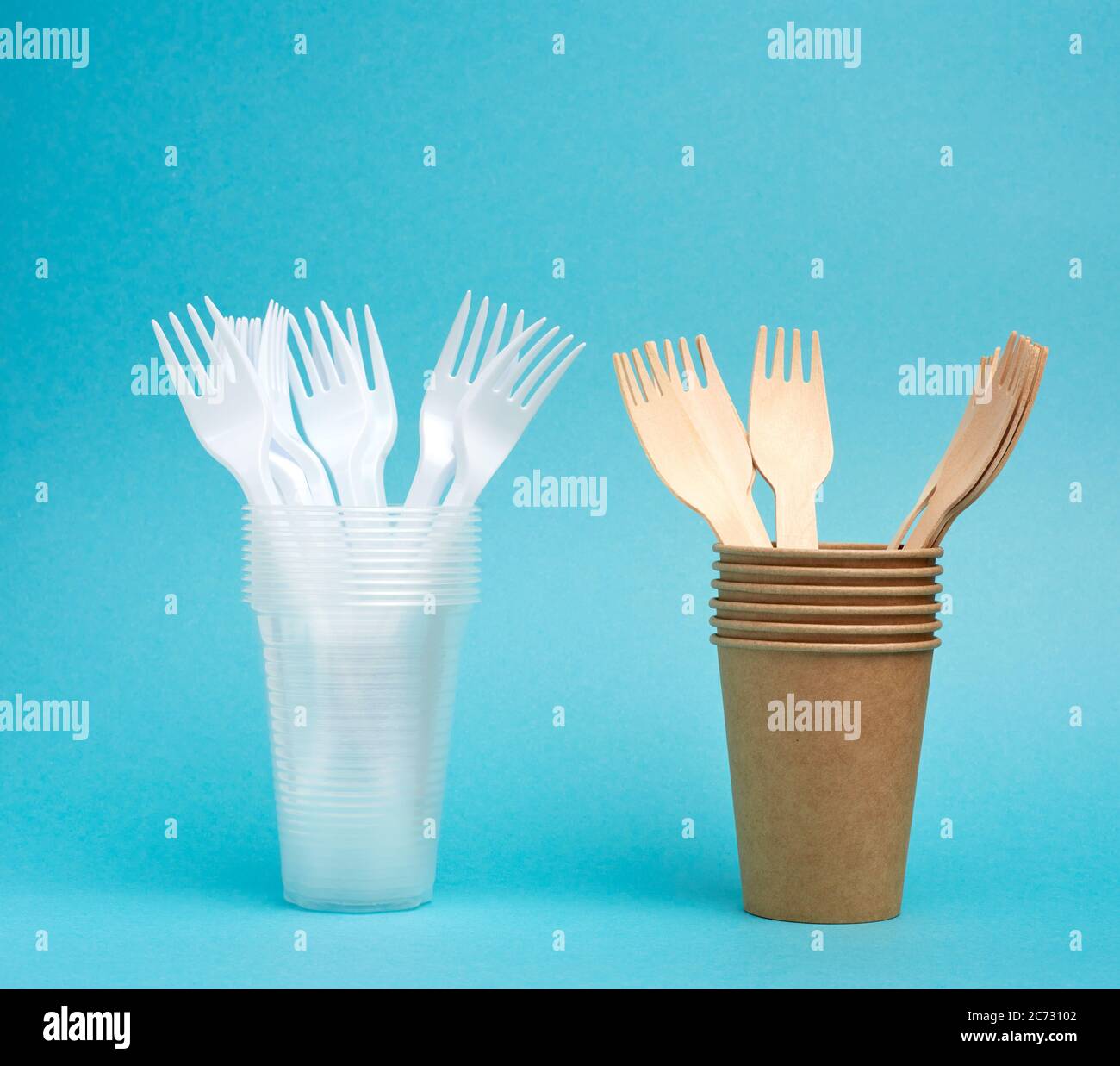 non-degradable plastic cups and fork from disposable tableware and a ...
