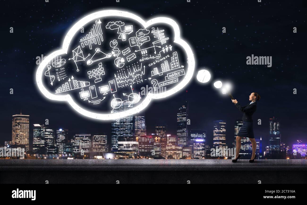 Woman throwing light on her ideas Stock Photo - Alamy