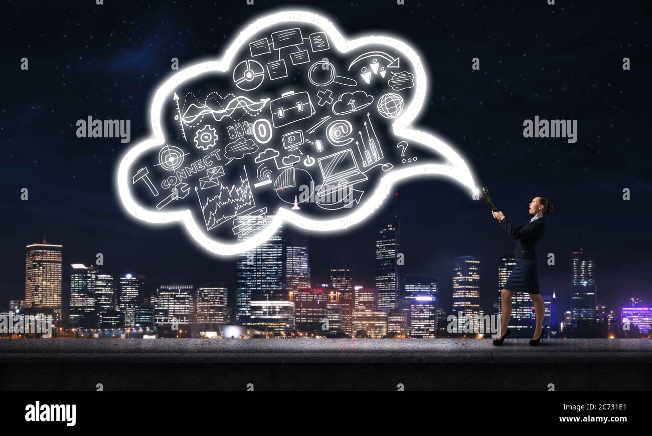 Woman throwing light on her ideas Stock Photo - Alamy