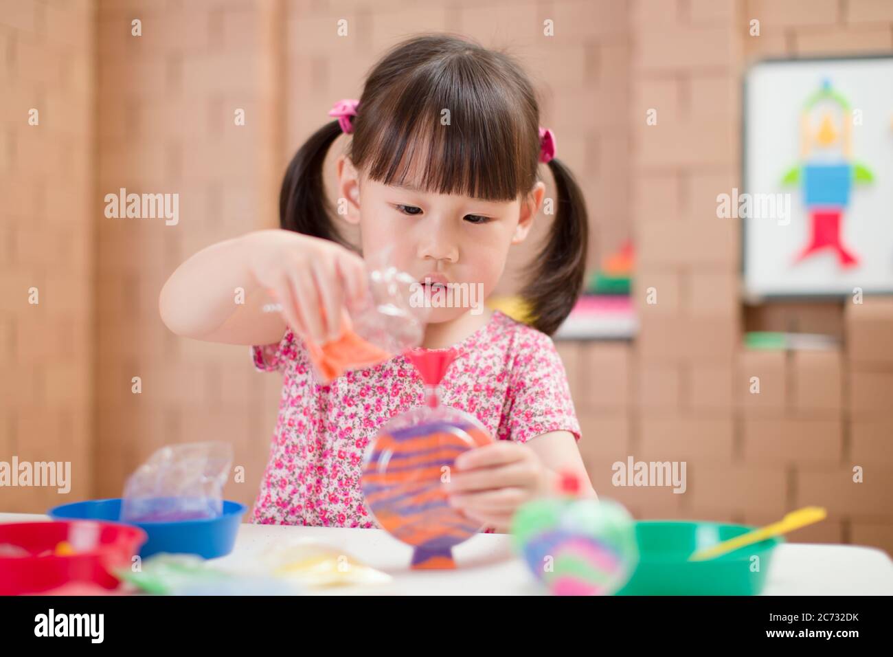 toddler girl making sand animal crafts for homeschooling Stock Photo ...