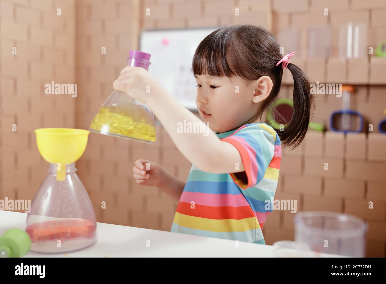 toddler girl play science experiments for homeschooling Stock Photo - Alamy