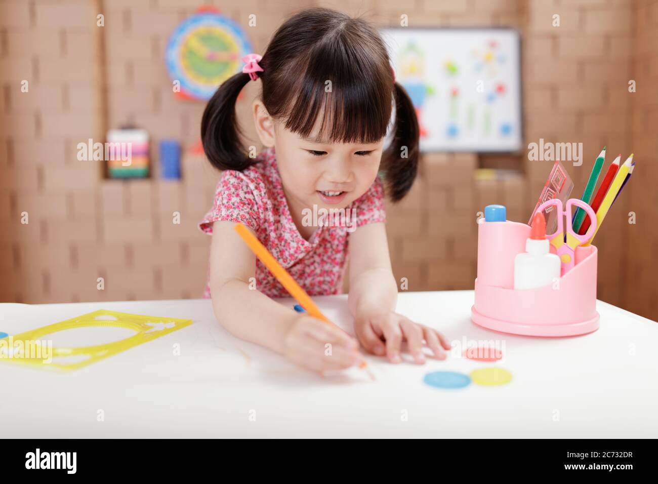 toddler girl practice drawing different shapes for homeschooling Stock ...