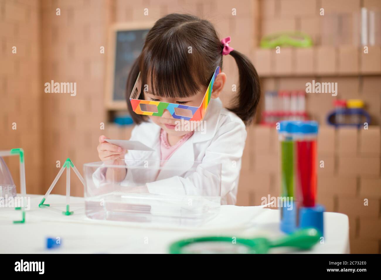 toddler girl play science experiments for homeschooling Stock Photo - Alamy