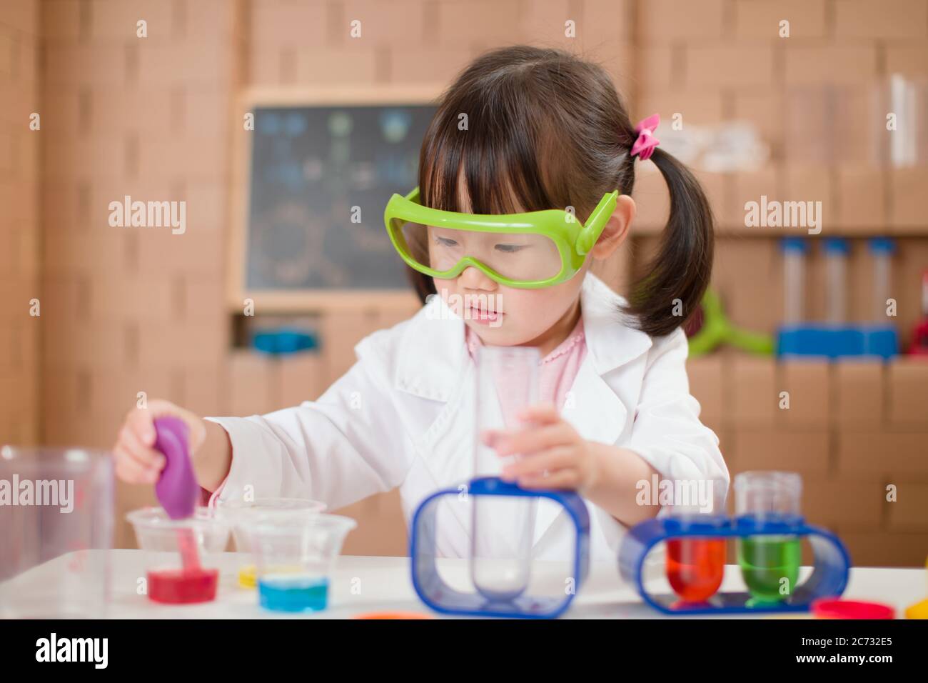 toddler girl play science experiments for homeschooling Stock Photo - Alamy