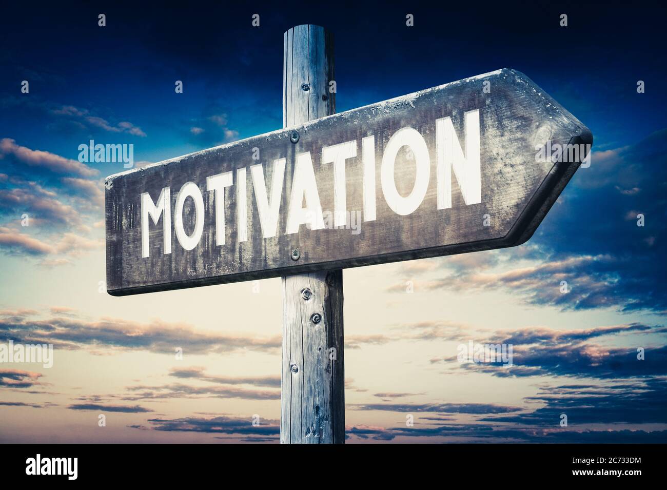 Motivation - wooden signpost, roadsign with one arrow Stock Photo - Alamy