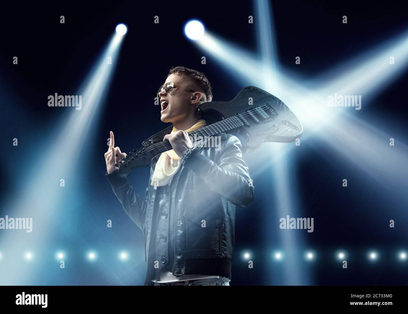 Rock star on stage Stock Photo - Alamy