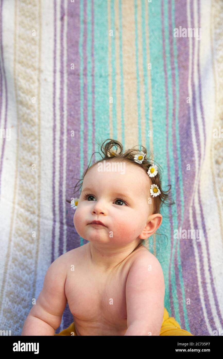 Portrait of a baby leaning forward looking up off camera Stock Photo ...