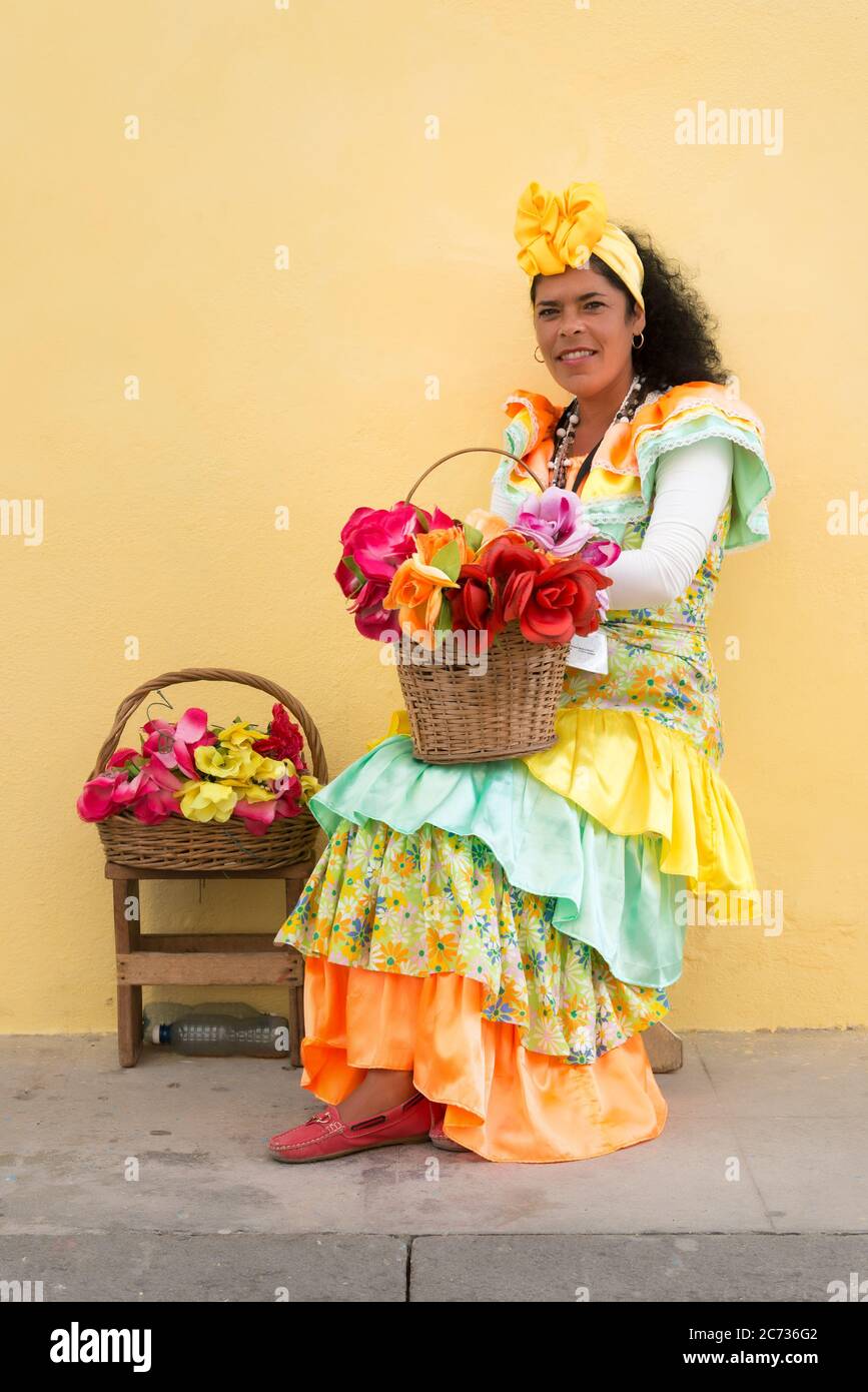 Attractive cuban woman wearing a traditional dress in Old Havana Stock ...