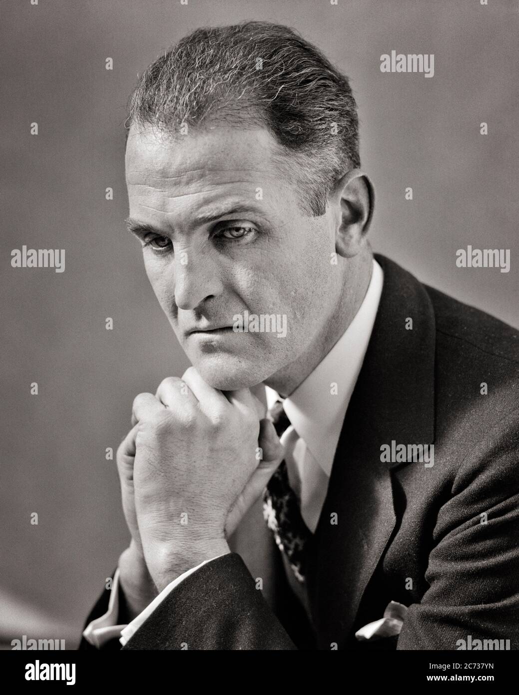 1920s PORTRAIT MATURE MAN BUSINESSMAN WEARING SUIT AND TIE RESTING CHIN ...