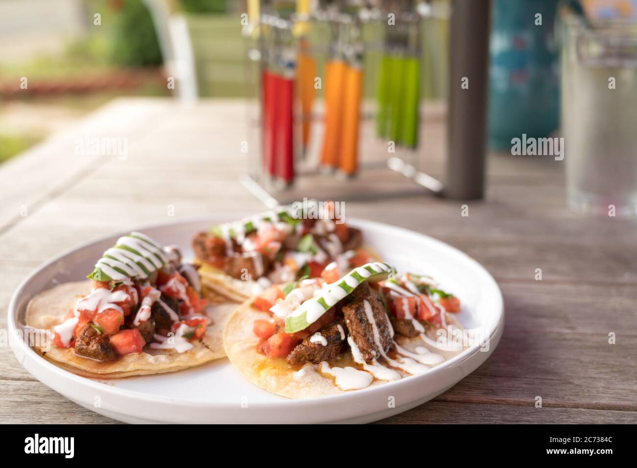 Delicious Mexican beef tacos on restaurant table Stock Photo - Alamy