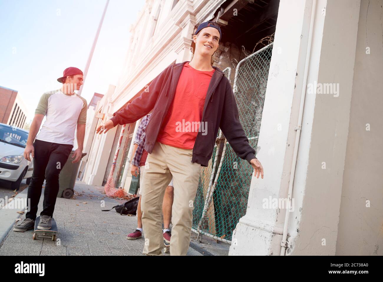Three guys walking together in hi-res stock photography and images - Alamy