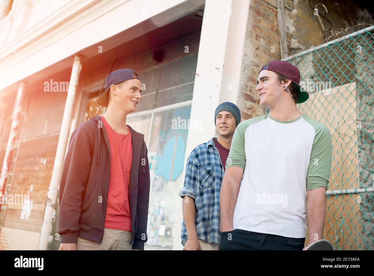 Three guys walking together in hi-res stock photography and images - Alamy