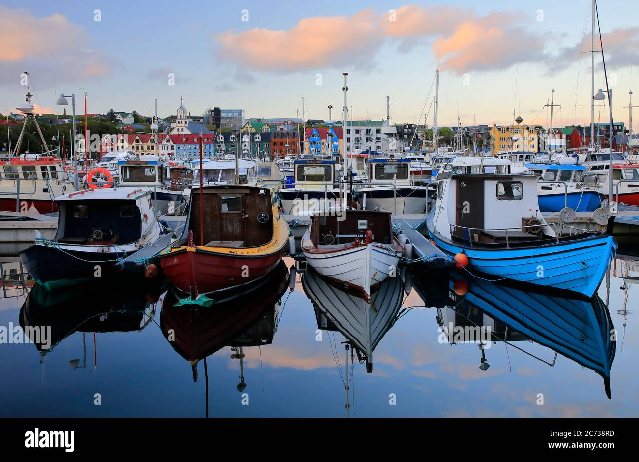 Recreational and fishing boats docking in the harbor of Torshavn ...