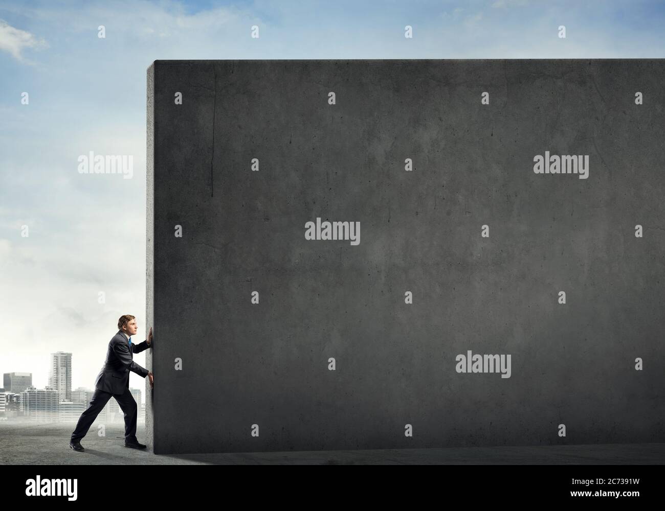 Businessman push wall Stock Photo - Alamy