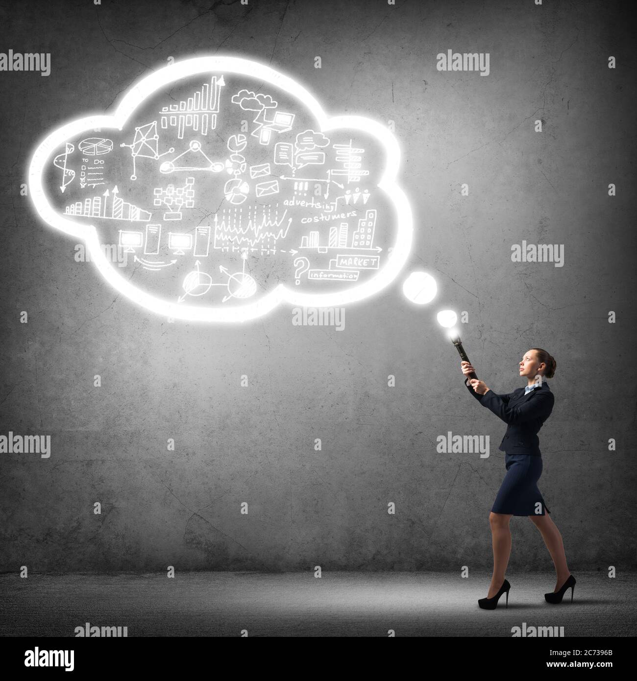 Woman throwing light on her ideas Stock Photo - Alamy
