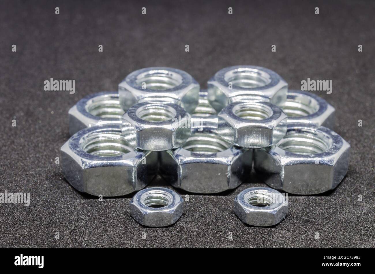 A Studio Photograph of a Collection of Hexagonal Metal Nuts Stock Photo ...