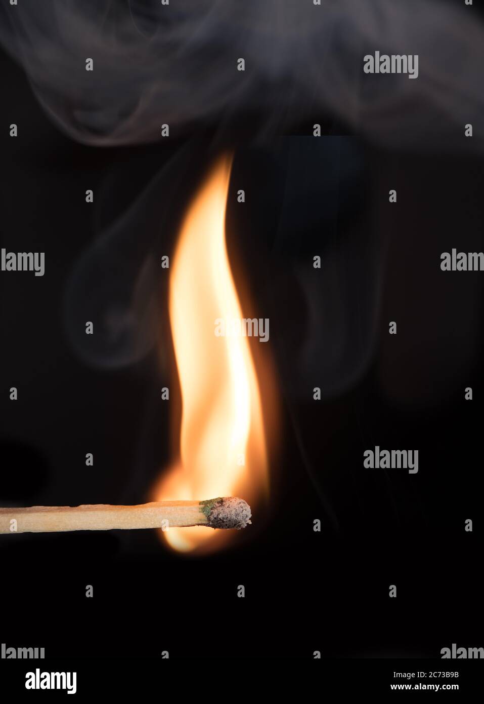 Flame burning on match Stock Photo - Alamy