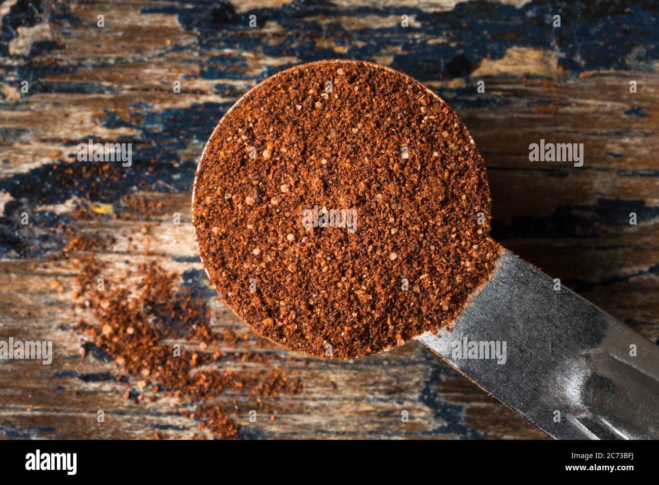 Chili Powder Spilled from a teaspoon Stock Photo - Alamy