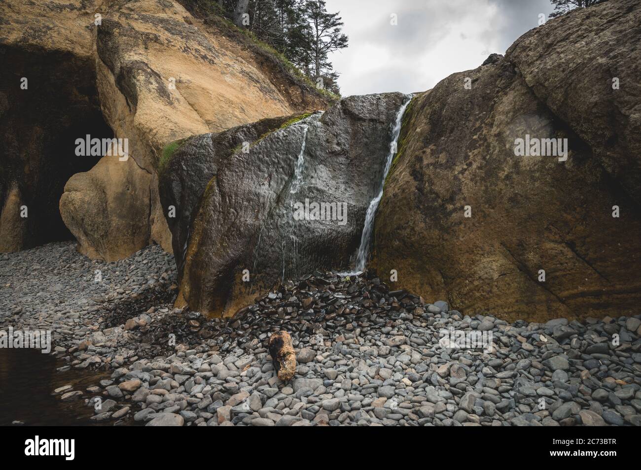 Beach waterfall and caves at Hug Point State Park in Oregon Stock Photo ...