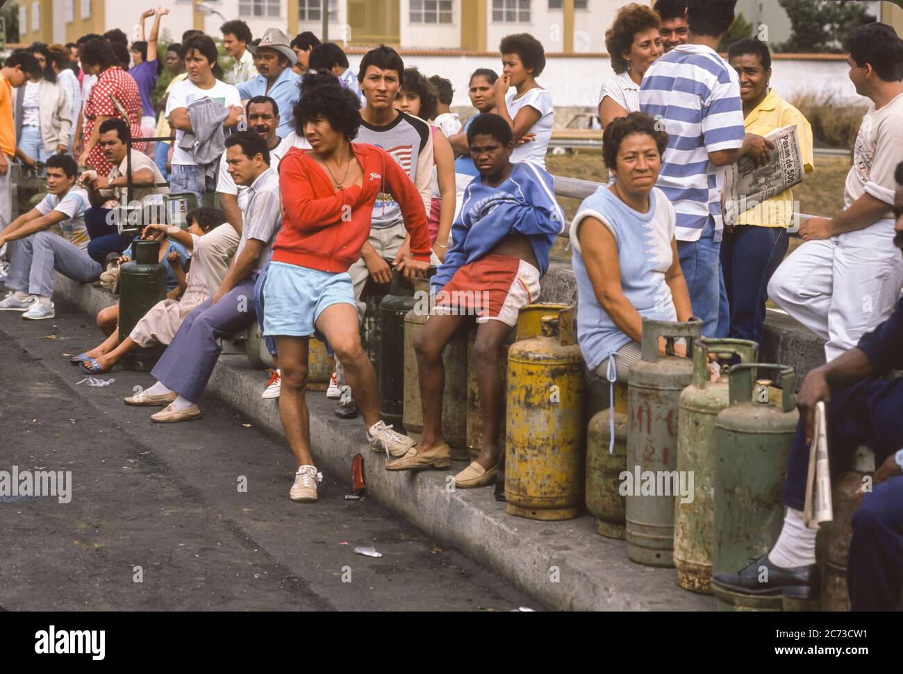 PETARE, CARACAS, VENEZUELA, 1989 - People waiting on line to refill ...