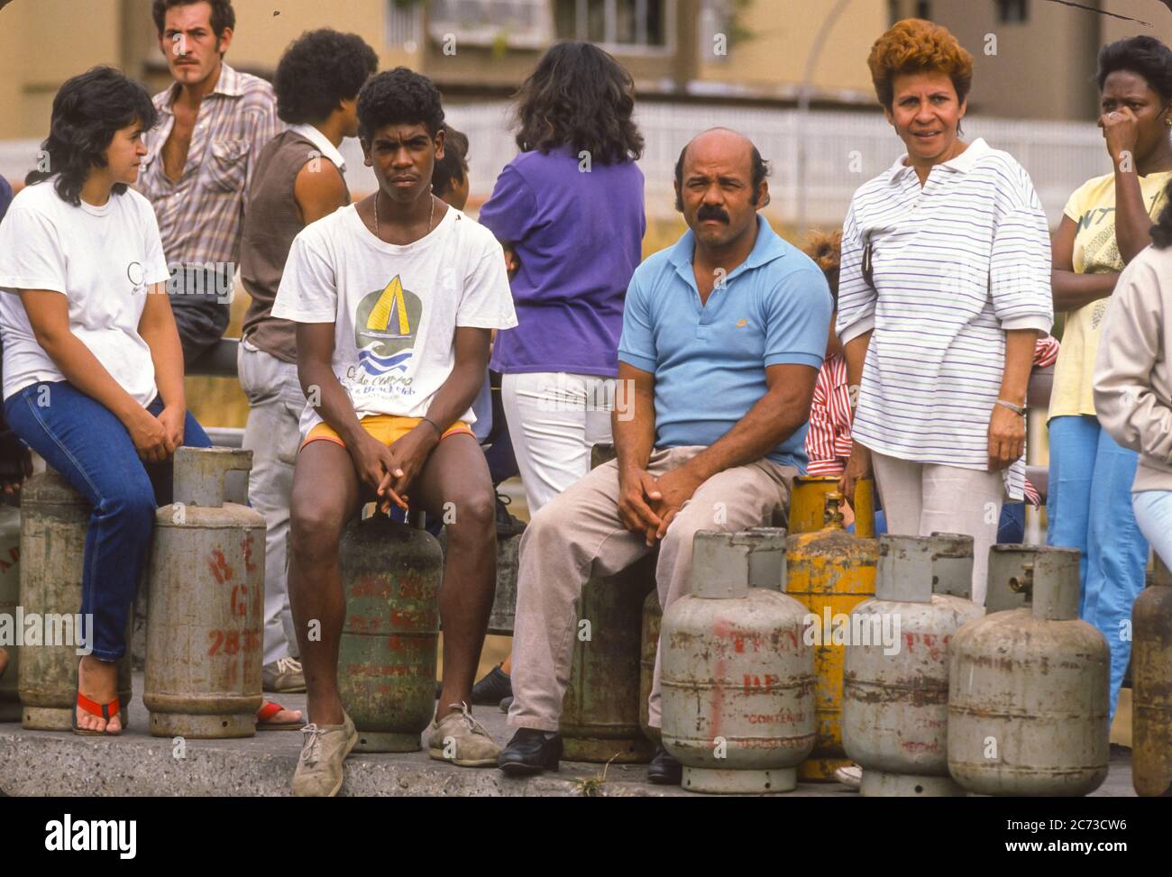PETARE, CARACAS, VENEZUELA, 1989 - People waiting on line to refill ...