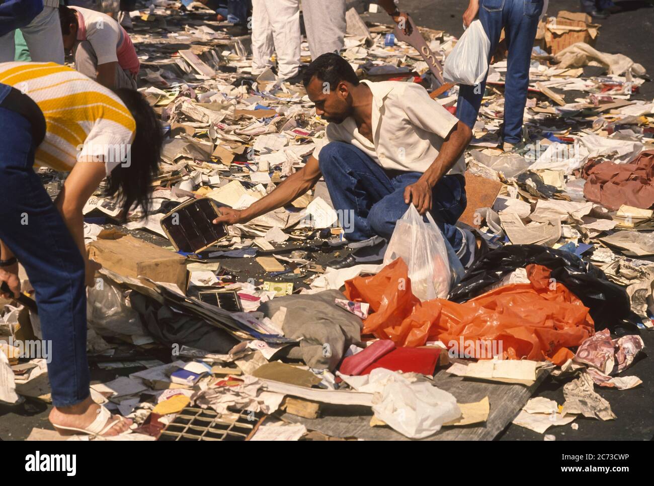 CARACAS, VENEZUELA, MARCH 2,1989 - People scavenging remnants of looted ...