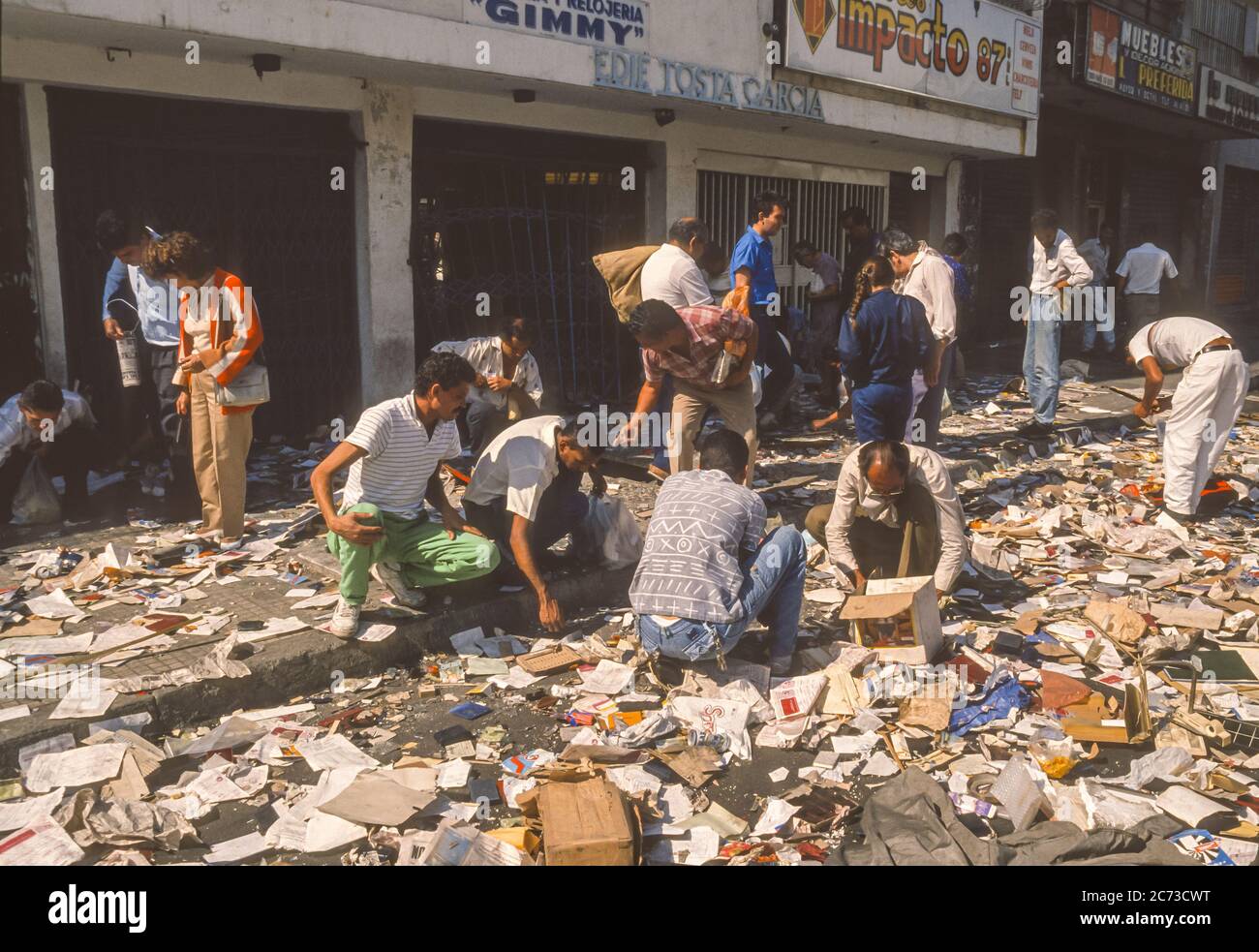CARACAS, VENEZUELA, MARCH 2,1989 - People scavenging remnants of looted ...