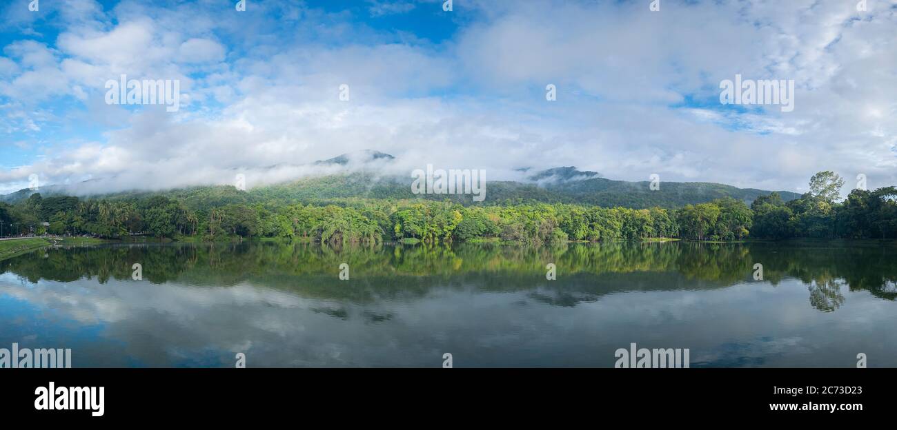 Panorama green mountain with water reflection in lake water Stock Photo ...