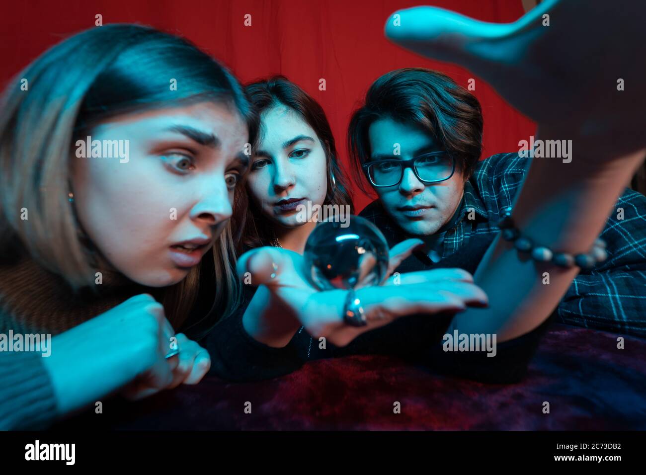 Group of people and woman fortune teller with crystal ball Stock Photo ...