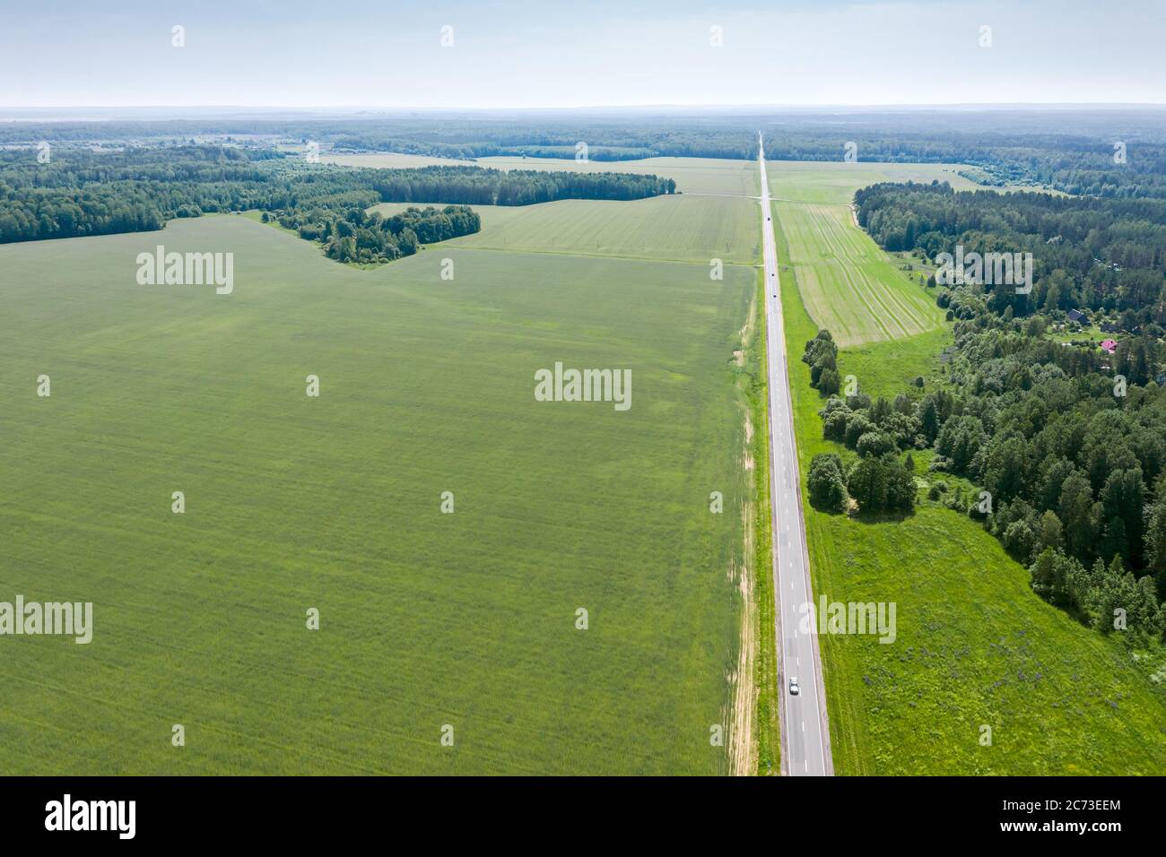 aerial view of straight road in countryside. traffic on country road ...