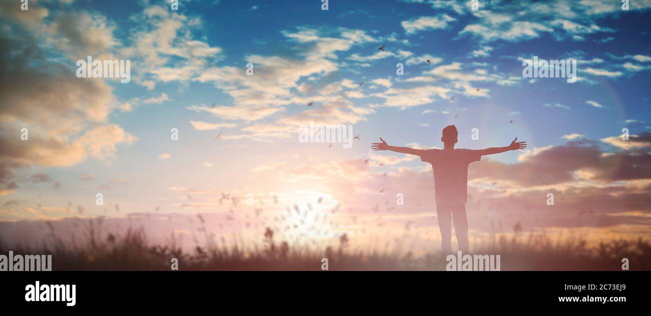 Happy man rise hand Worship God in morning view. Christian spirit ...