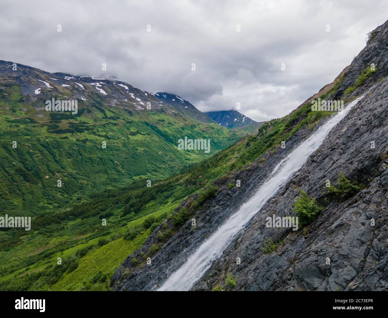 Waterfall, trees, glacial valley bliss Stock Photo - Alamy