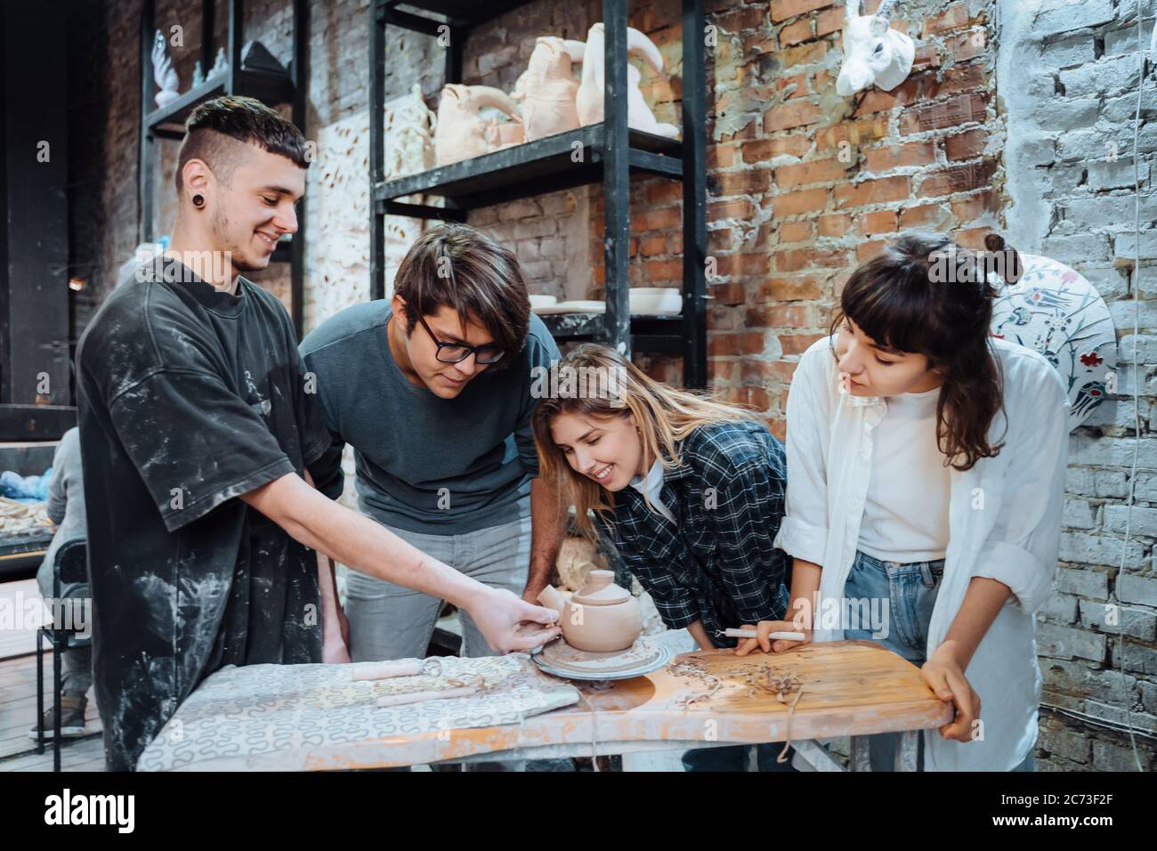 Making a handmade clay pot. Pottery lesson with master Stock Photo - Alamy