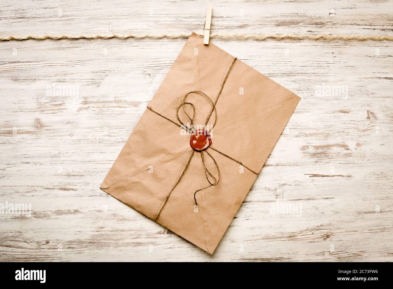 Mail envelope on rope Stock Photo - Alamy