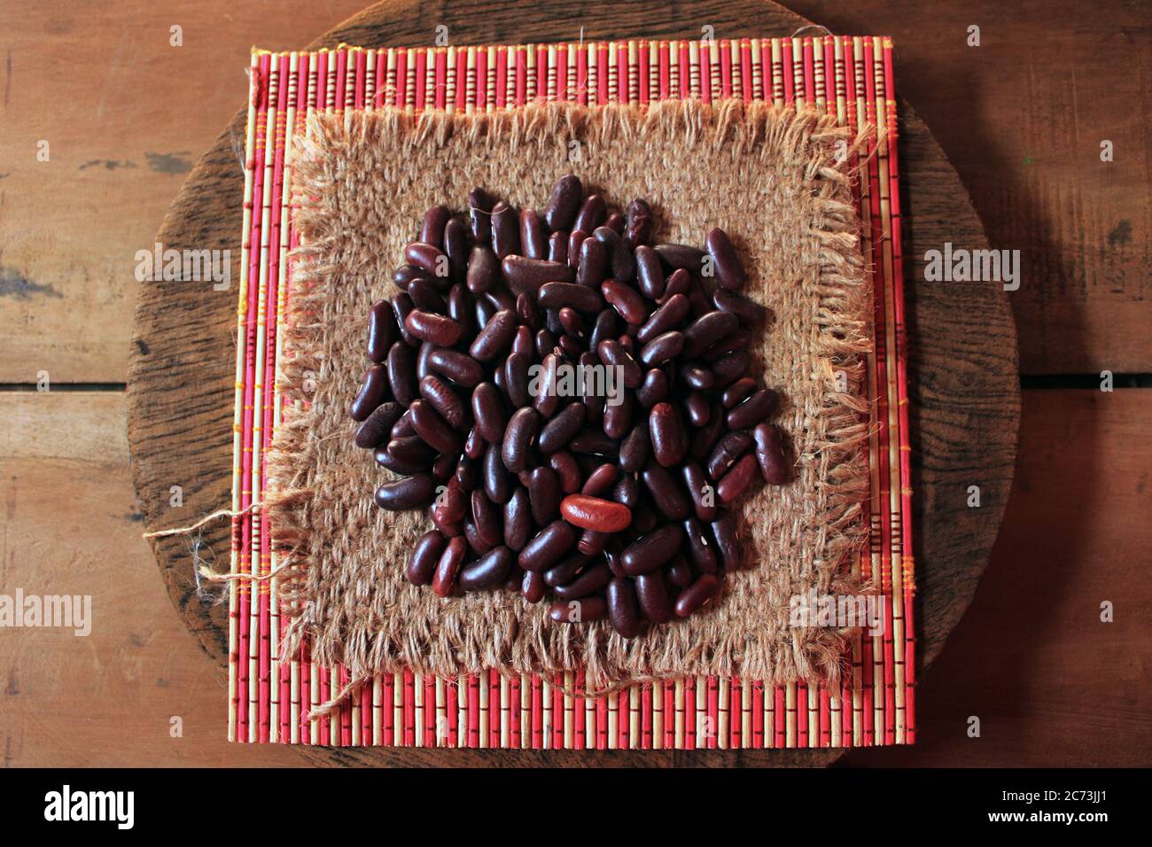 Red kidney beans isolated on wooden background. Closeup of Multiple red ...