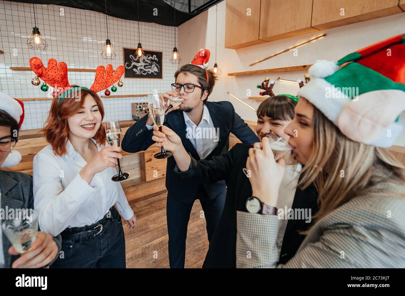 Happy colleagues in office celebrate special event Stock Photo - Alamy