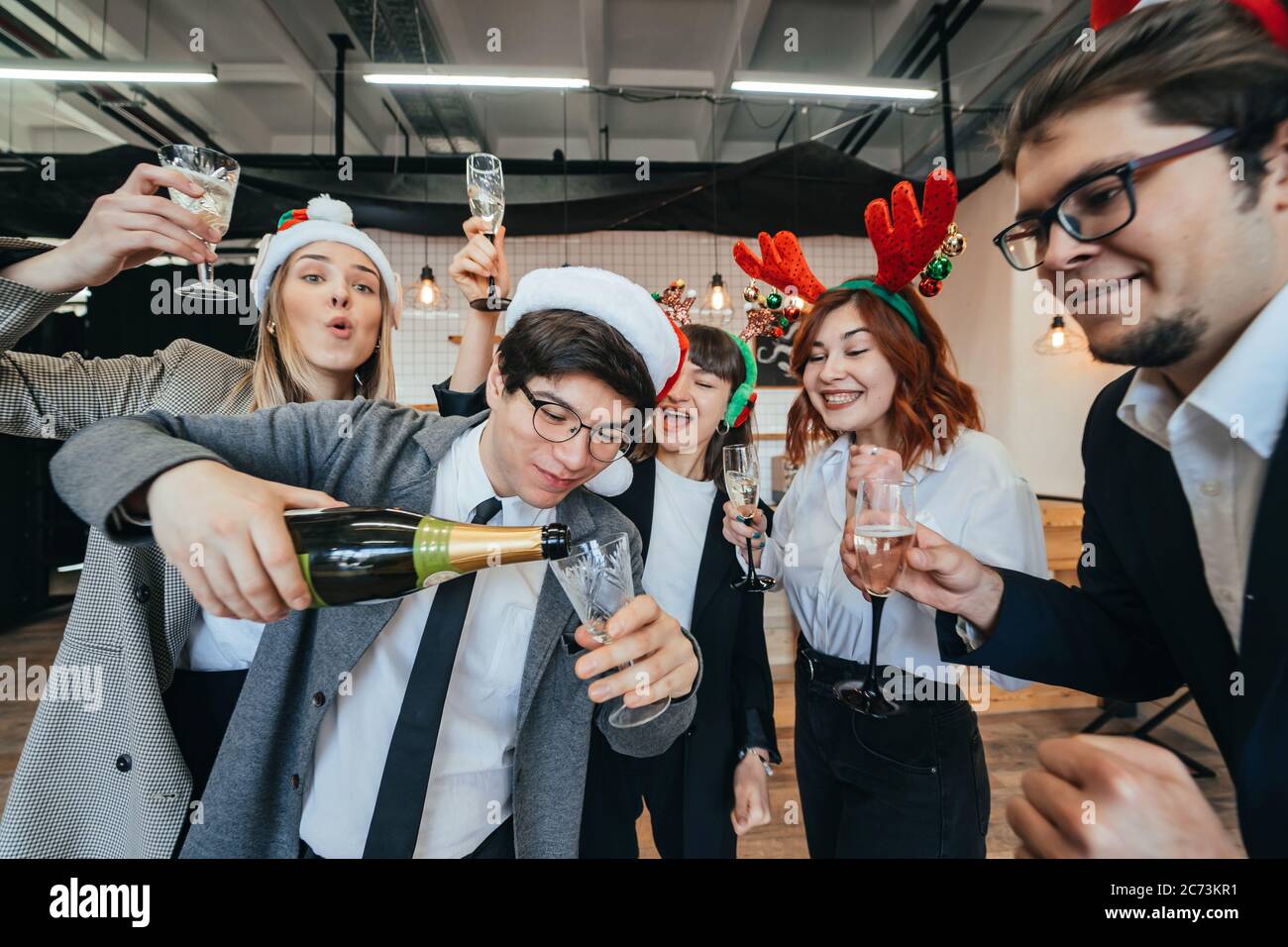 Happy colleagues in office celebrate special event Stock Photo - Alamy