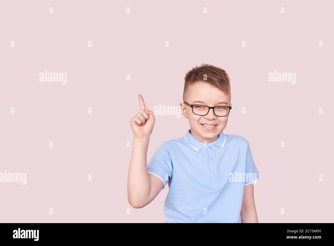 Pretty young student pointing. Elementary school children Stock Photo ...