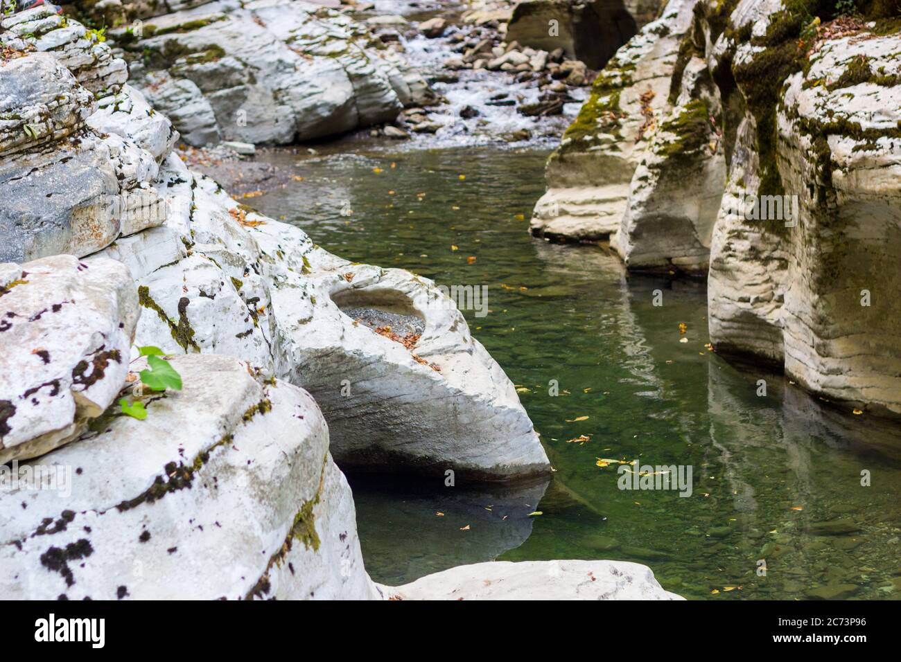 Mountain river flows into the gorge in summer Stock Photo - Alamy