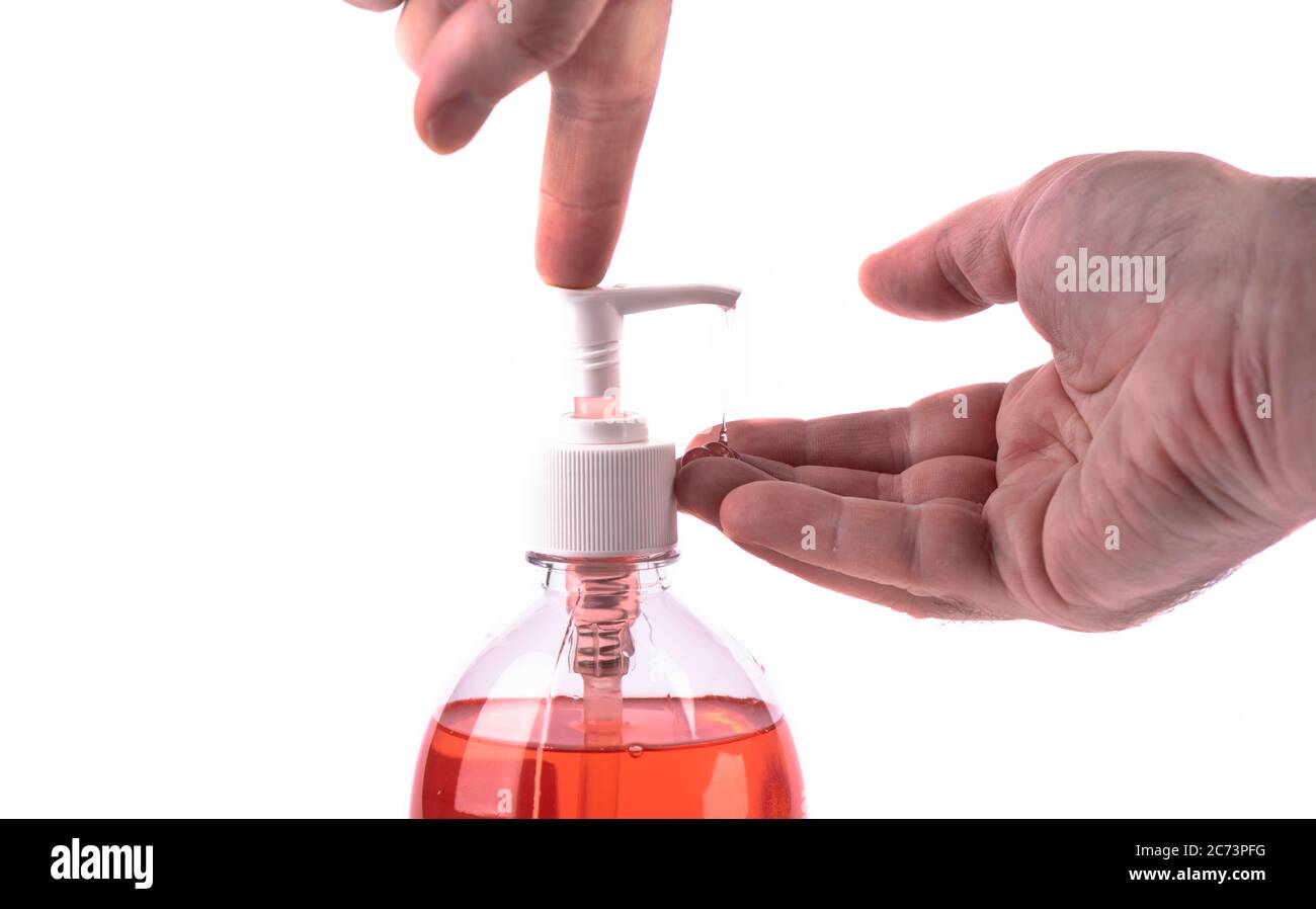 Man using liquid soap for hand washing. Anti coronavirus hygiene. Red ...
