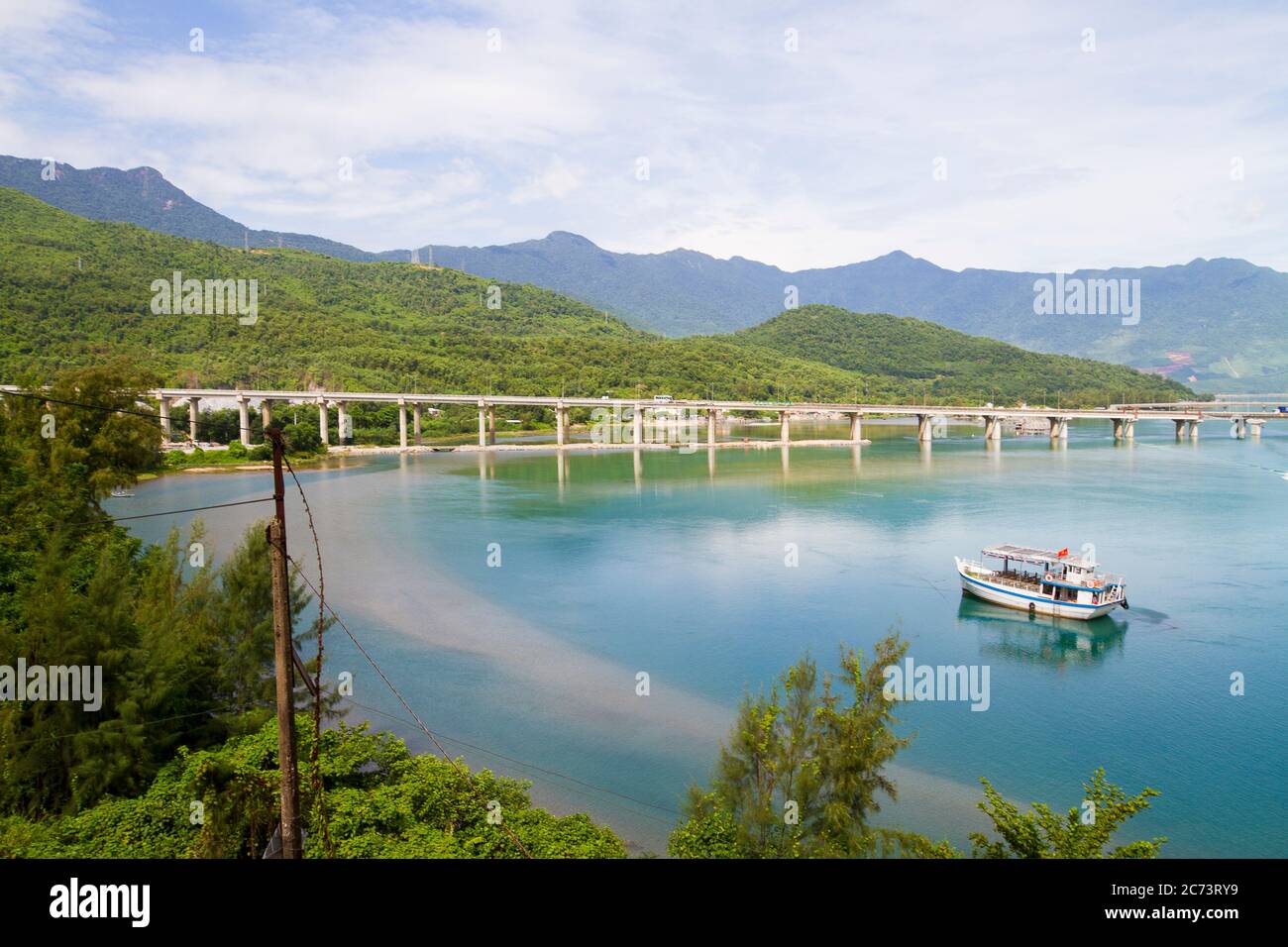 Beautiful landscape of Lang Co bay in sunny morning. Boat on the beach ...