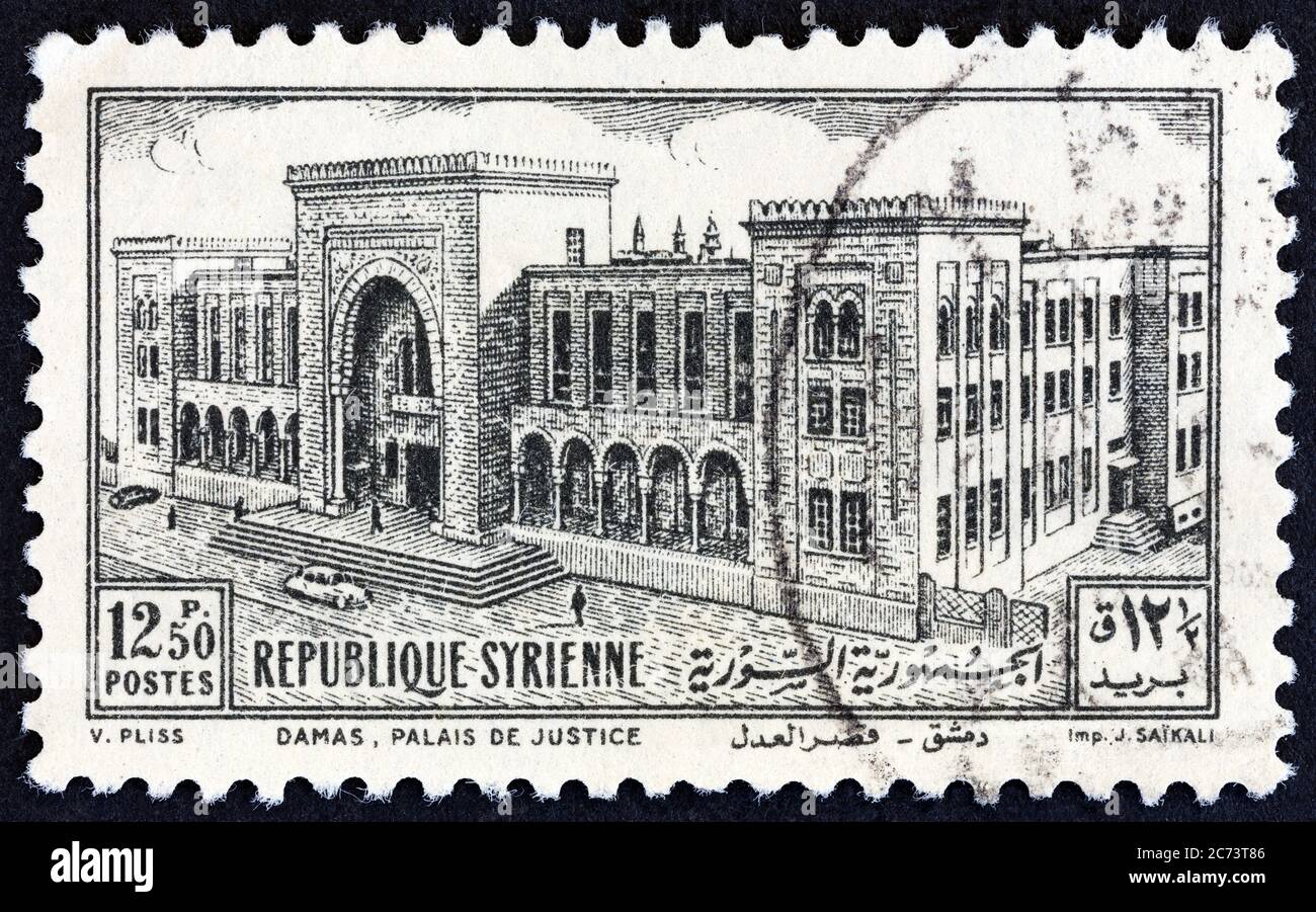 SYRIA - CIRCA 1952: A stamp printed in Syria shows Palace of Justice ...