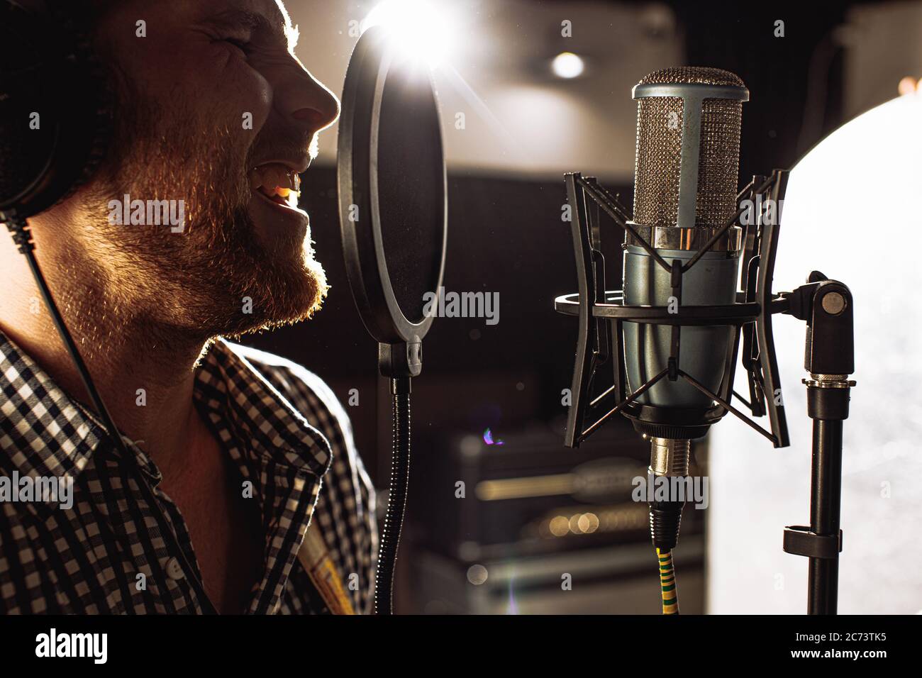professional caucasian singer man sing in recording studio. handsome ...