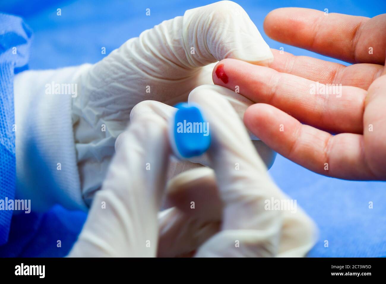 Insulin testing process, blood test and syringe. Injection in the hand ...