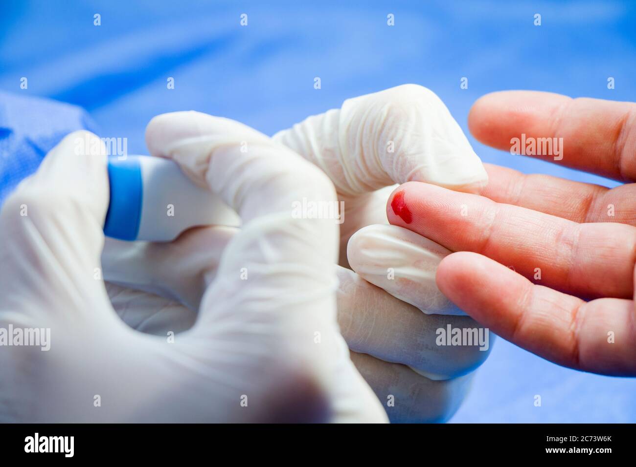 Insulin testing process, blood test and syringe. Injection in the hand ...
