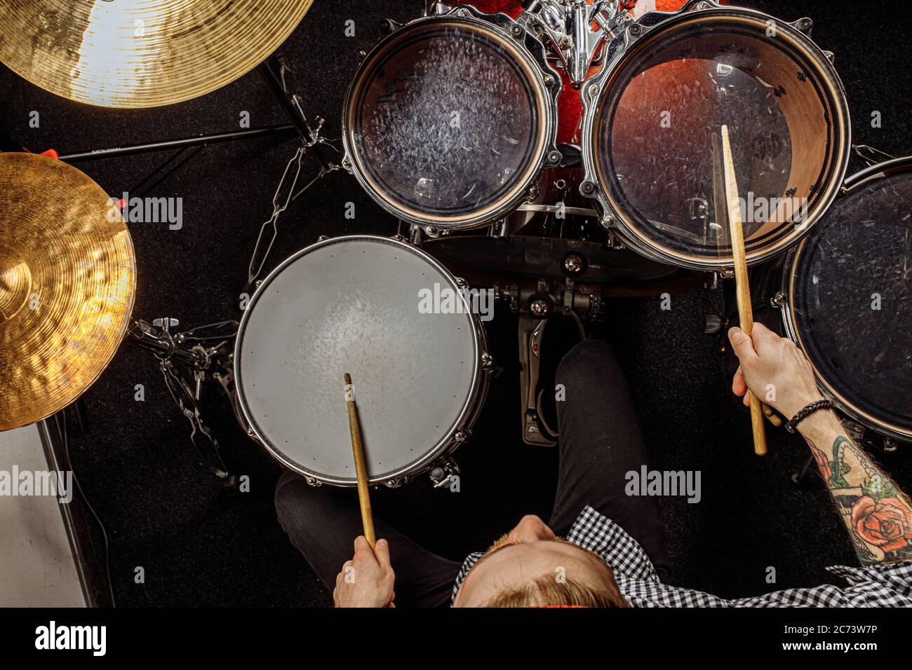 top view on professional drummer playing on drums. unrecognizable male ...